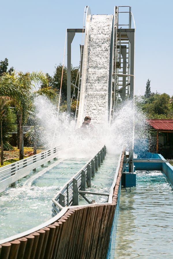 Tourists in Boat on Water Slide Attraction Stock Photo - Image of tour ...