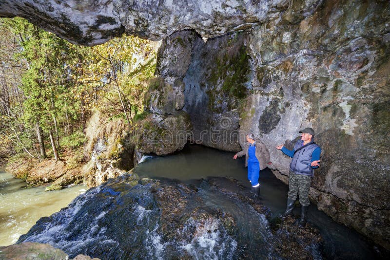 Tourists-cavers Explore the Grotto in the Atysh Karst Cave and the ...