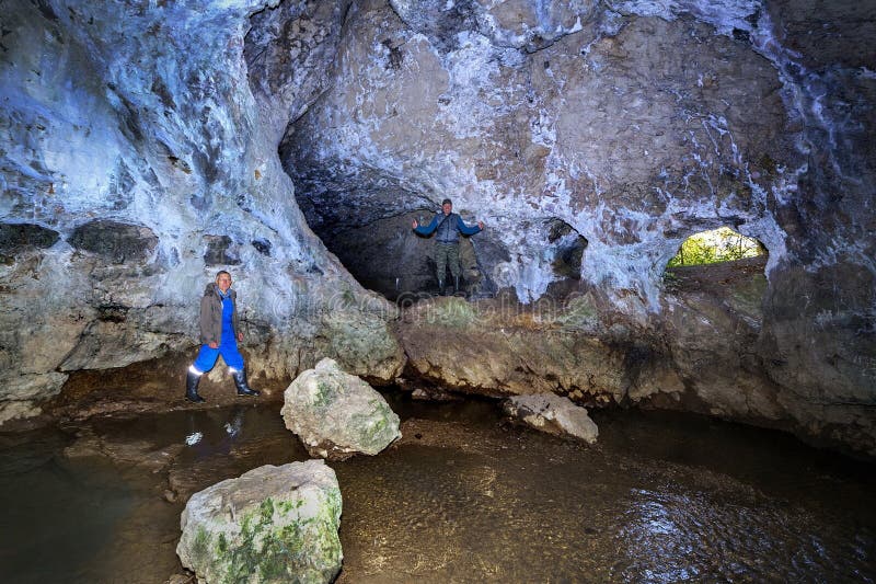 Tourists-cavers Explore the Grotto in the Atysh Karst Cave and the ...