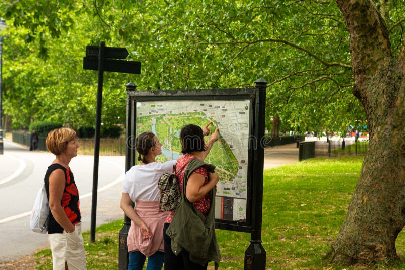 Tourists checking the map editorial photo. Image of place - 156409746