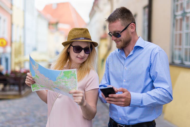 Tourists on City Trip Using Smartphone and City Map Stock Photo - Image ...