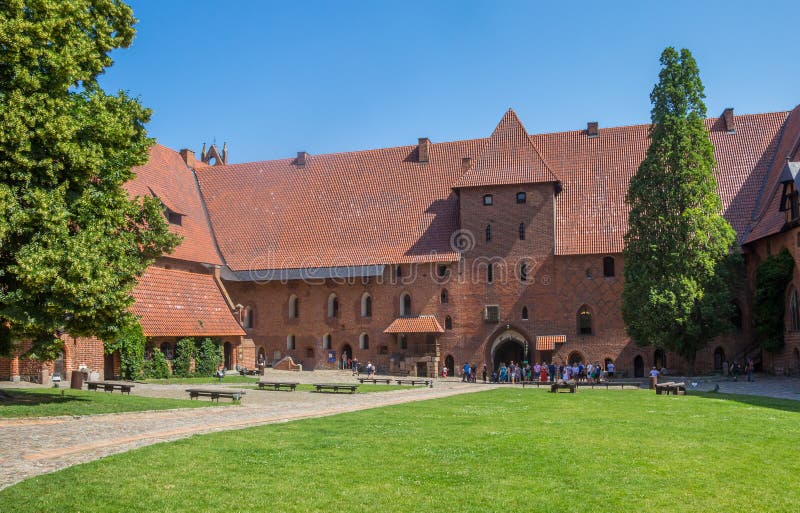 Tourists in the Courtyard of the Historic Castle of Malbork Editorial ...