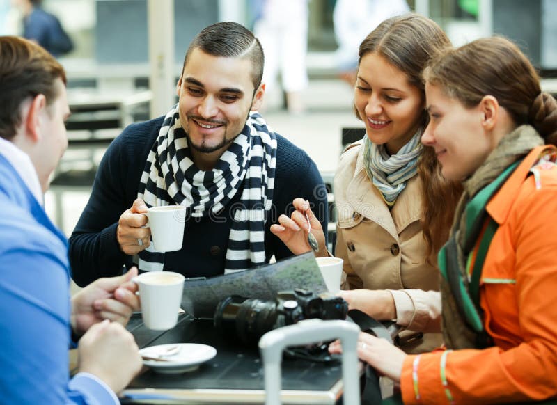 Tourists Drinking Coffee at Cafe and Reading City Map Stock Photo ...