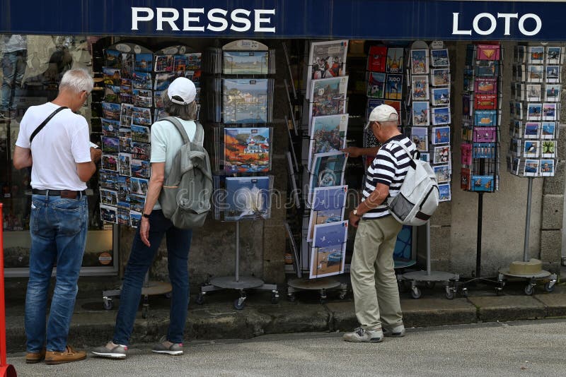 Tourists on Holiday in France Choosing Postcards Editorial Photo ... Tourists on Holiday in France Choosing Postcards Editorial Photo ...