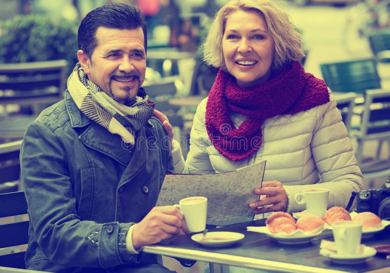 Tourists Having Coffee at Cafe and Reading Map Stock Photo - Image of ...