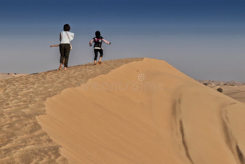 Tourists Having Fun in the Desert of Abu Dhabi. UAE Stock Image - Image ...