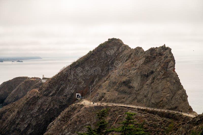 Tourists and Hikers Walking on Mountain Path into Tunnel in Mountain ...