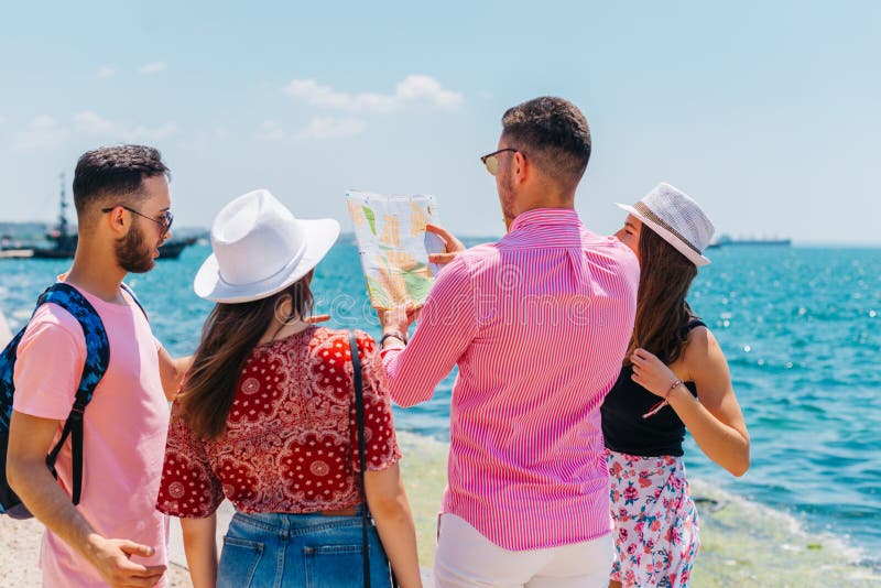 Tourists Looking at a Map and Planning the Places they are Supposed To ...