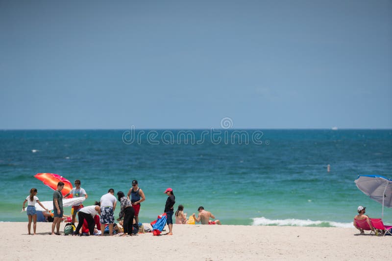 Tourists on Miami Beach. Getting Ready for a Day at the Beach Editorial ...