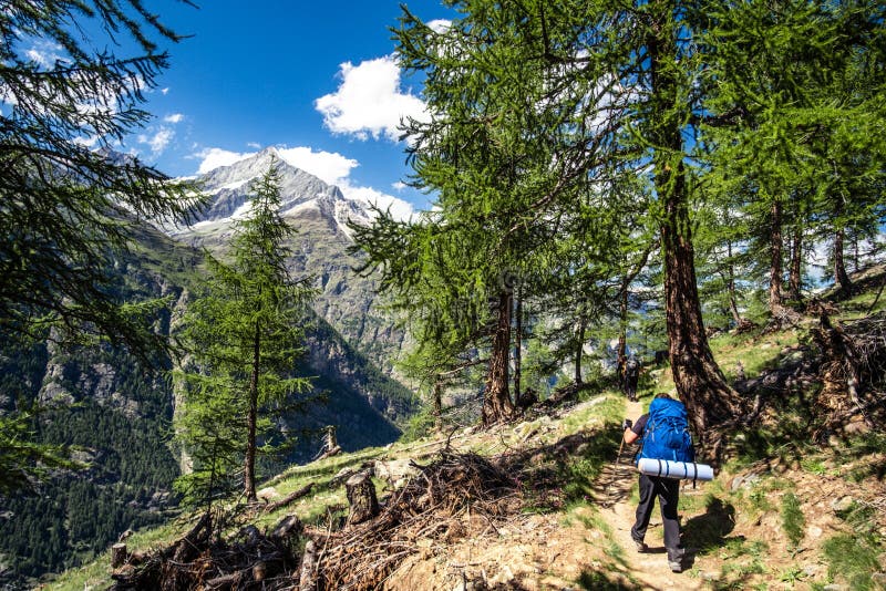 Tourists in mountains stock photo. Image of climbing - 189410454