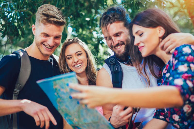 Tourists Searching for Direction Using Paper Map Stock Photo - Image of ...