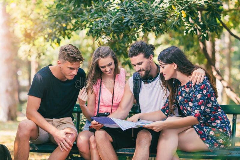 Tourists Searching for Direction Using Paper Map Stock Photo - Image of ...