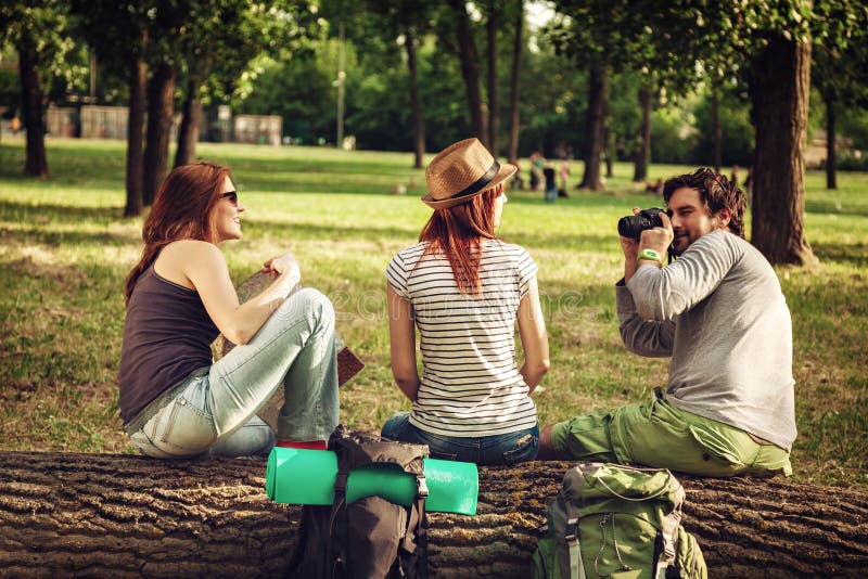 Tourists Taking a Rest stock image. Image of examining - 41333361
