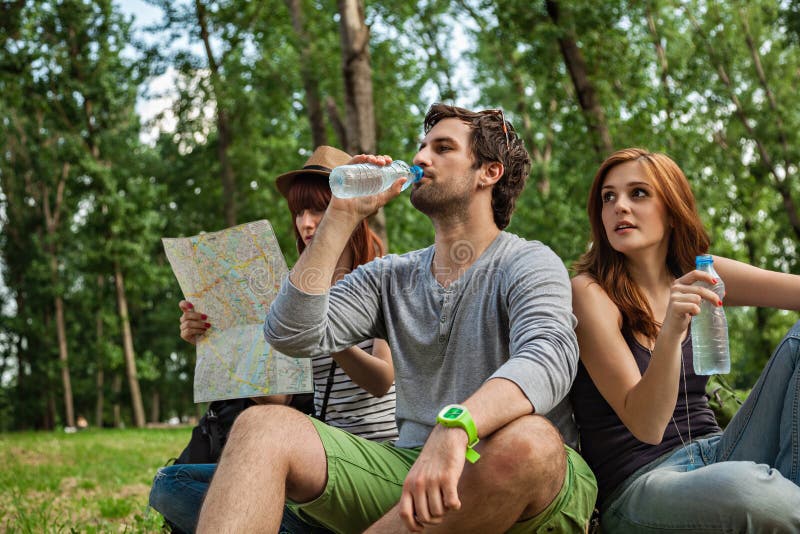 Tourists Taking a Rest stock image. Image of examining - 41333175