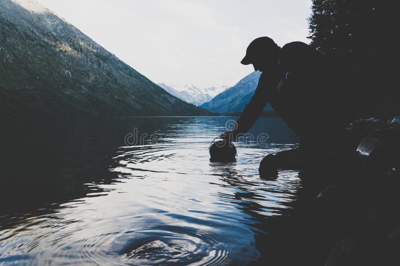 Tourists Taking Water from Freshwater Lakes into the Pot for Cooking ...