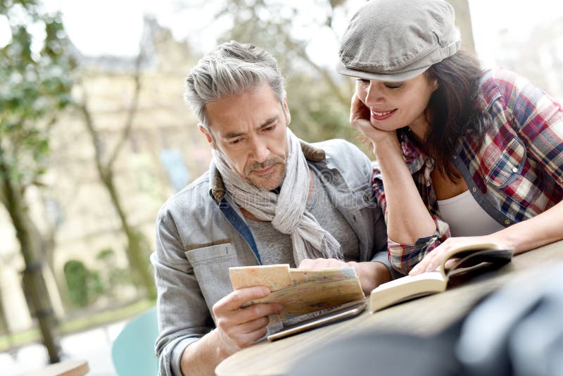 Tourists in Town Looking at City Guide Stock Photo - Image of cafacopy ...