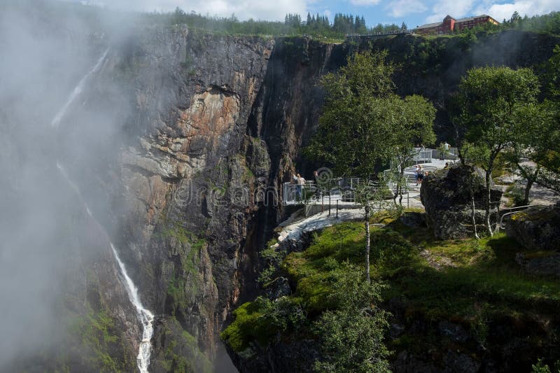 Tourists on a Viewing Platform Overlooking a Misty Waterfall. Stock ...