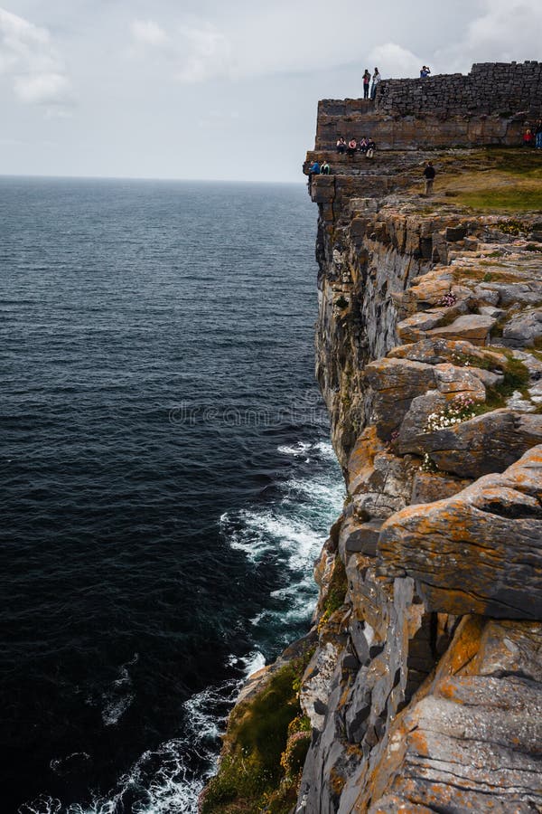 Tourists Walk Along Edge of Cliffs on Inishmore Island Editorial ...