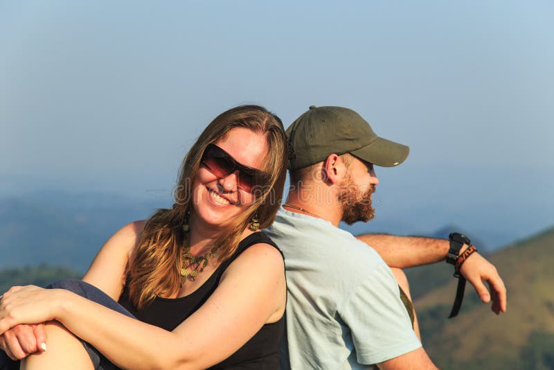Tourists Watching the Sunset on Top of the Mountain. Stock Photo ...