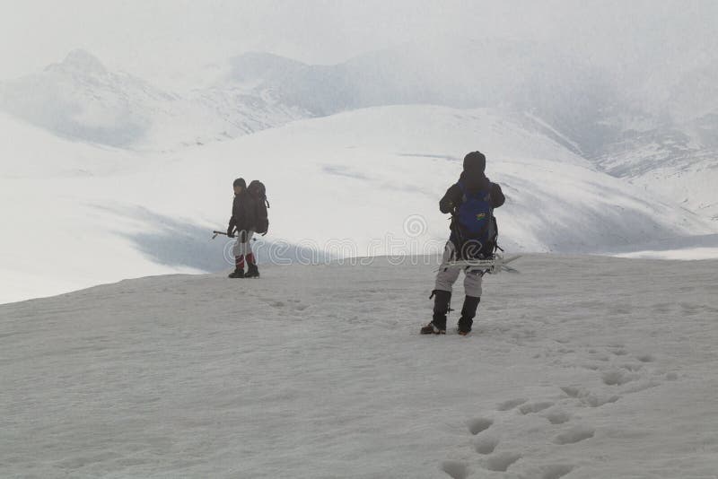 Tourists in a Winter Mountain Stock Photo - Image of mountaineering ...