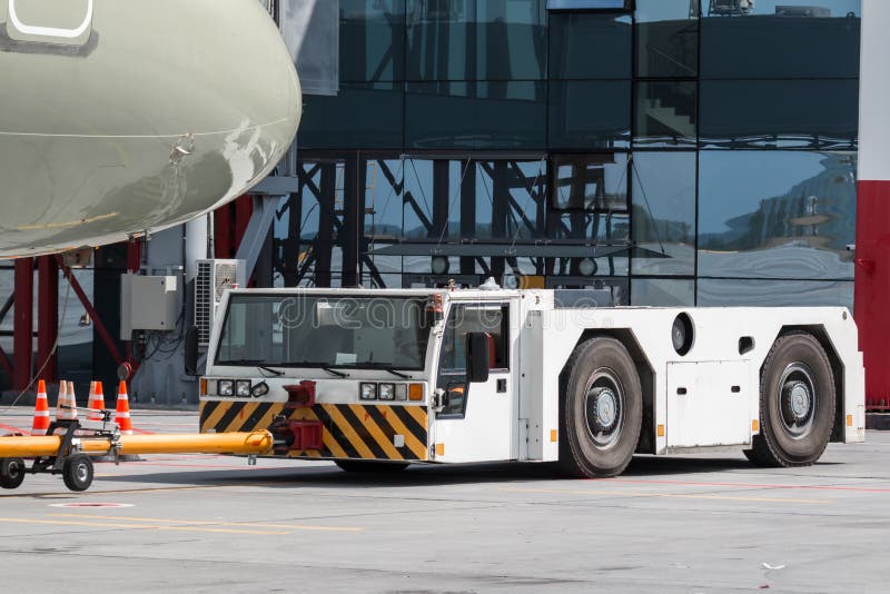 Tow Truck Pushes the Passenger Jet Plane Stock Photo - Image of ...