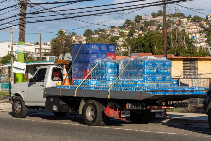 Tow Truck Transporting Stacked Cardboard Boxes of Water Editorial Image ...