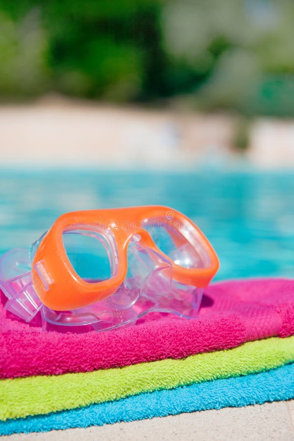Towels and Goggles Near the Swimming Pool Stock Image - Image of green ...