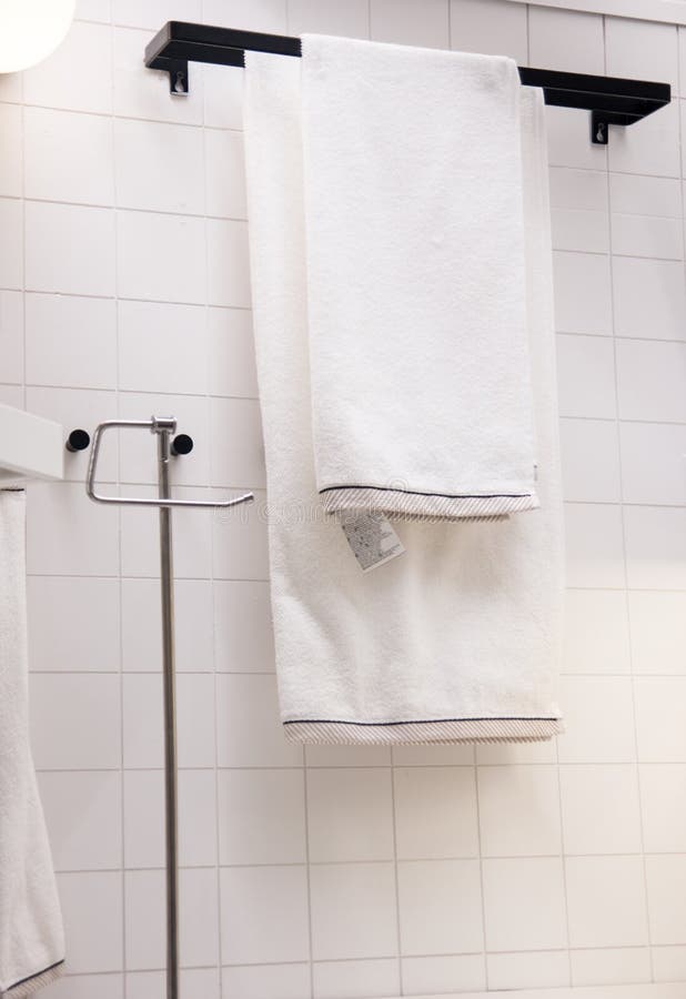 Towels Hanging in the Bathroom on a Towel Rack. Stock Photo - Image of ...