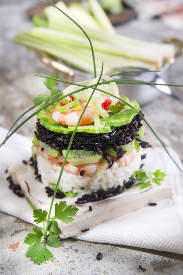 Tower of Black and White Rice with Shrimp and Zucchini Stock Photo ...