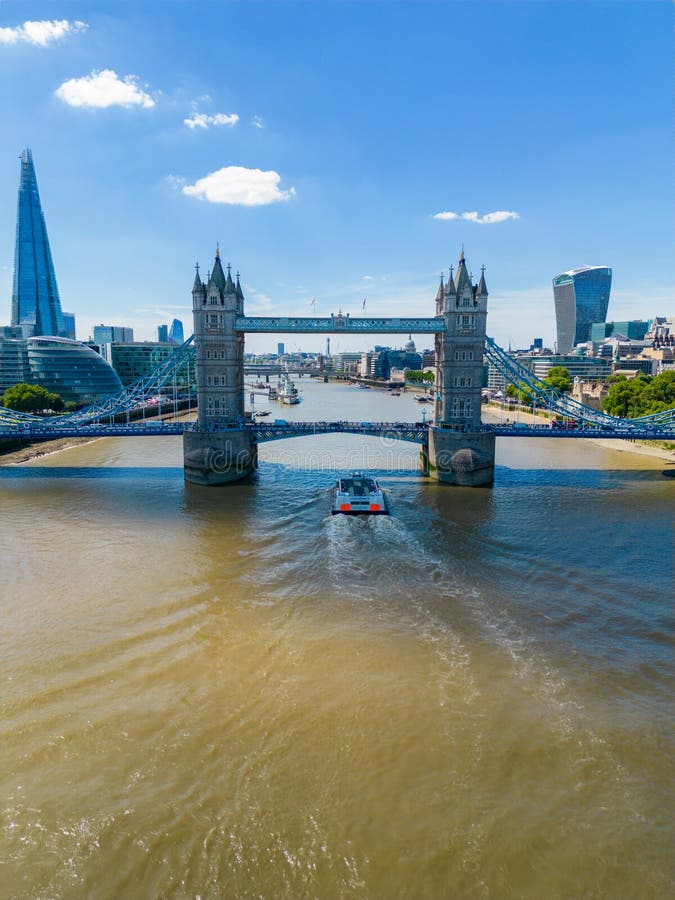 Tower Bridge in London with Tour Boat Passing Under Stock Photo - Image ...
