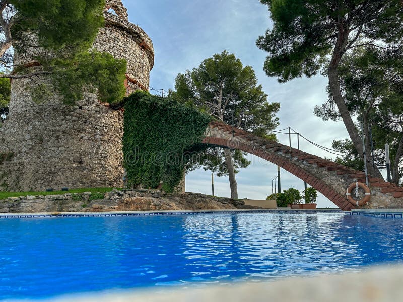 Old Stone Tower Over Swimming Pool Stock Image - Image of blur ...