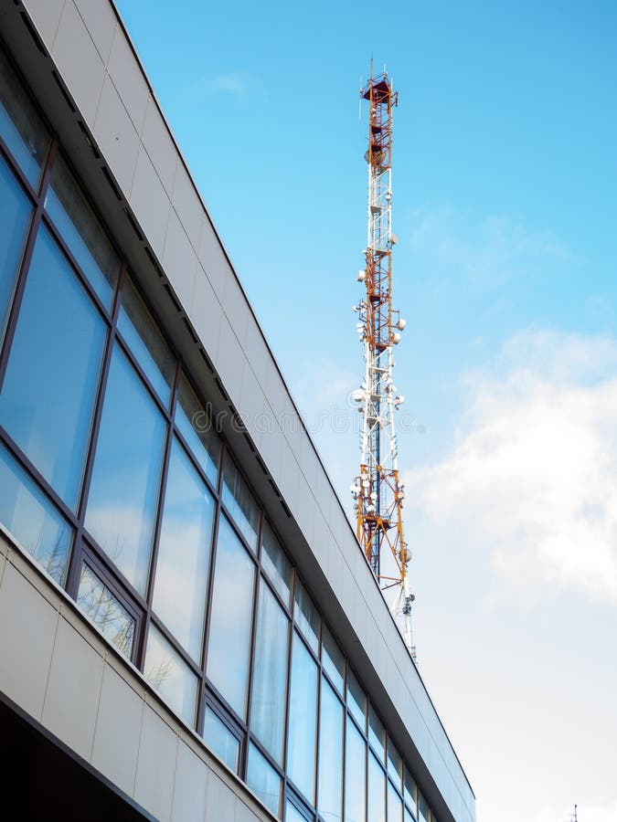 A Tower of a Cellular Company in the City. Construction Stock Image ...
