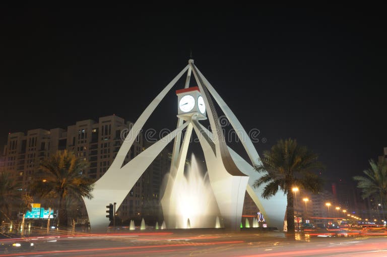 Tower Clock Roundabout, Dubai Stock Photo - Image of night, traffic ...