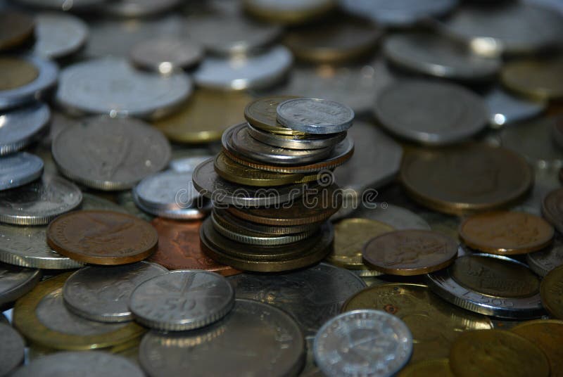 Tower of Coins of Different Countries Stock Photo - Image of debt ...