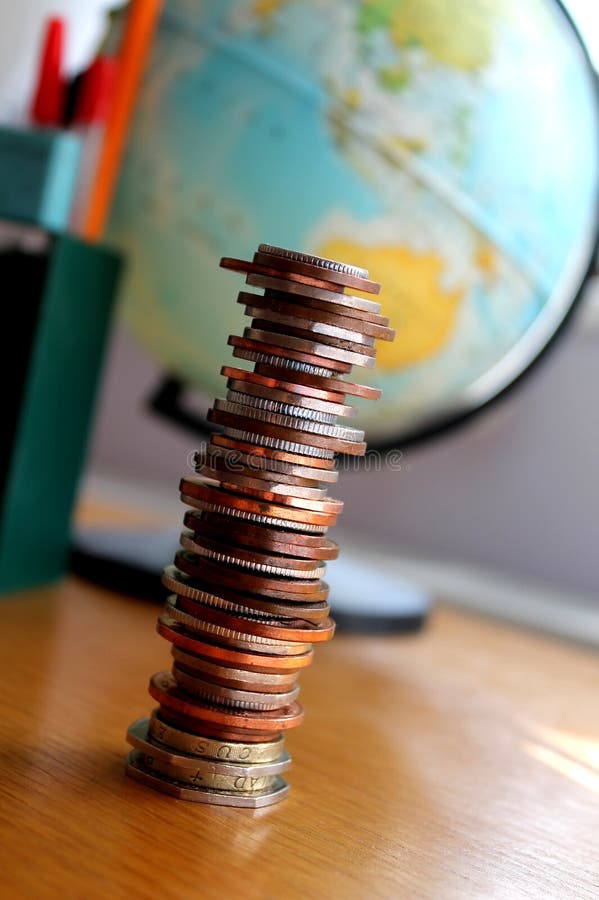 Tower of Coins with World Globe in the Background Stock Photo - Image ...