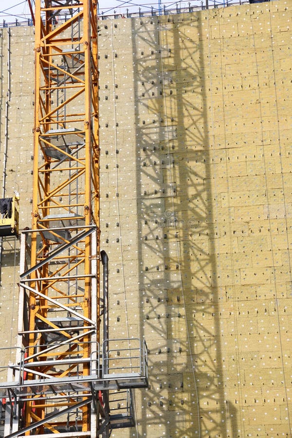 Tower of a Construction Crane on the Background of the Wall of a ...