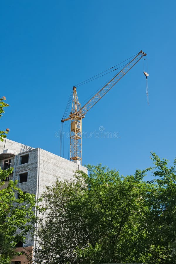 Tower Construction Site with Crane and Buildings with Blue Sky ...