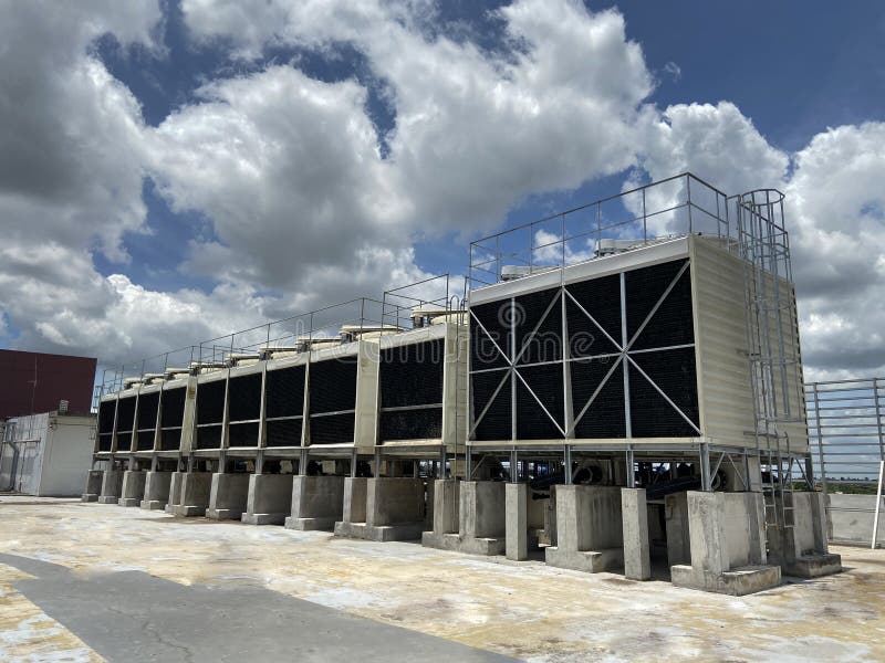 Cooling Tower Machinery in Large Buildings that is Clear Sky with White ...