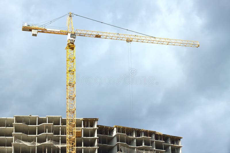 Tower Crane Above Top of Building Over Stormy Sky Stock Photo - Image ...
