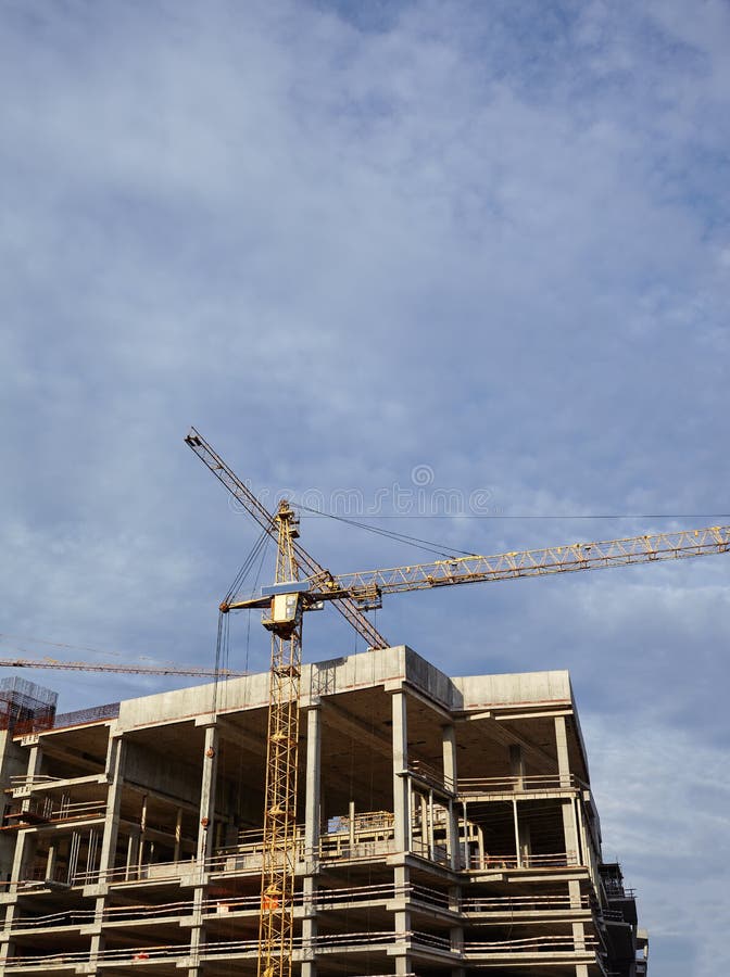 Tower Crane Building a House. Concrete Building Under Construction ...