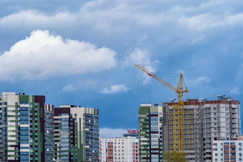 Tower Crane Builds a Monolithic-frame House in a Metropolis Stock Photo ...