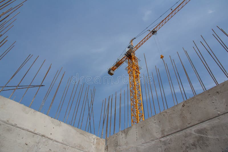 Tower Crane and Concrete Base of the Building. Construction Crane on ...