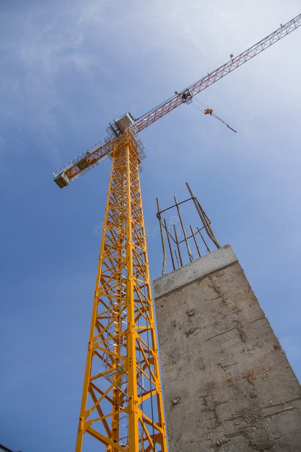 Tower Crane and Concrete Base of the Building. Construction Crane on ...