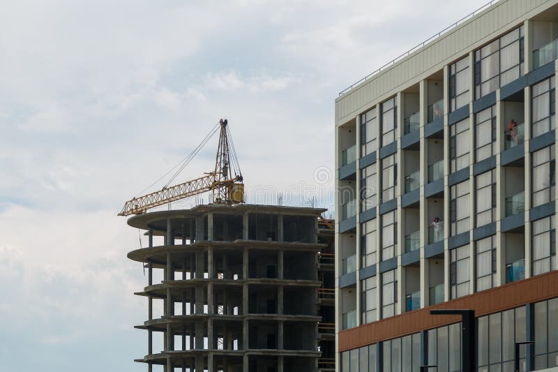 Tower Crane on the Construction of a Multi-storey Building in a New ...