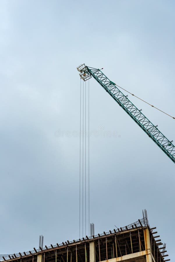 Tower Crane at the Construction Site of a High-rise Building, Against a ...