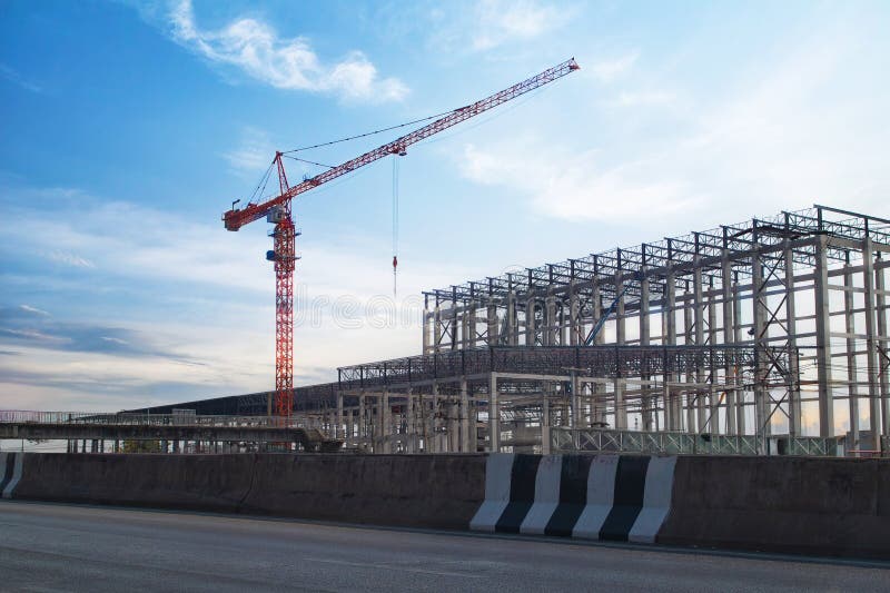 The Tower Crane at Construction Site Standby for Lifting Work among the ...