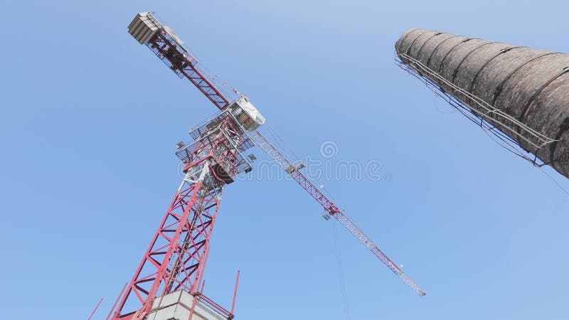 Tower Crane Working on a Construction Site. Construction Crane. Tower ... Tower Crane Working on a Construction Site. Construction Crane. Tower ...