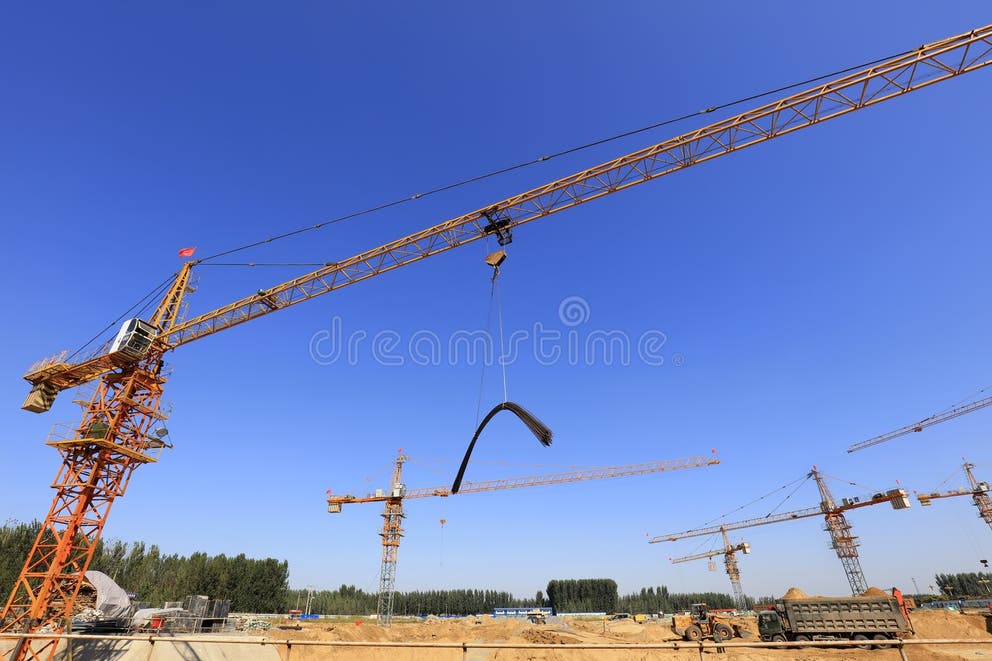 Tower Crane Hoisting Materials Stock Photo - Image of lever, steel ...