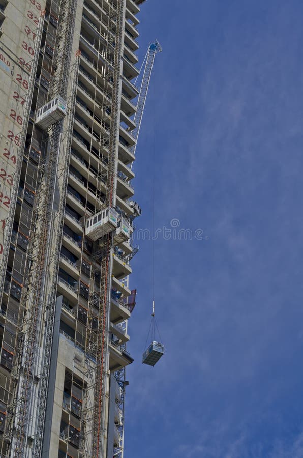 Tower Crane and Load stock photo. Image of lift, building - 65228652