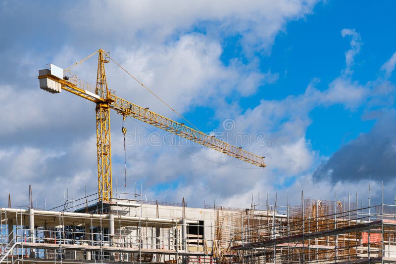 Tower Crane Over Building Under Construction in Scaffolding Stock Photo ...